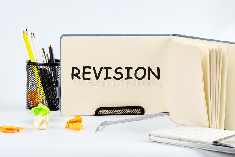 REVISION Written on a Blank Sheet of Notepad in the Stand Stock Photo ...