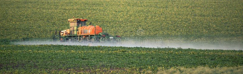 Revitalizing the Fields: a Tractor Sprayer at Work Stock Image - Image ...