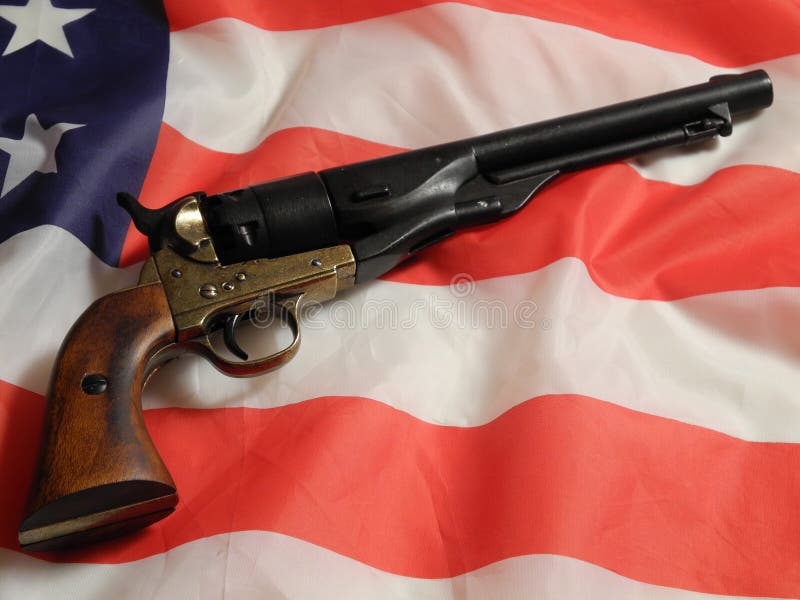 Revolver on American flag stock image. Image of revolver - 28069677