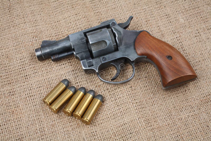 Revolver with Ammunition on the Canvas Stock Photo - Image of defense ...