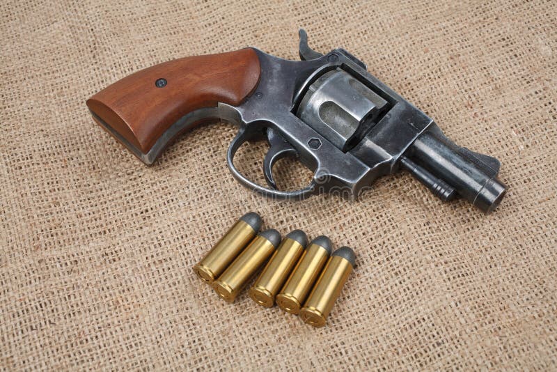 Revolver with Ammunition on the Canvas Stock Photo - Image of antique ...