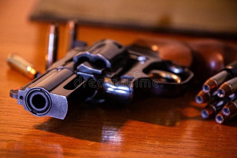Revolver with Bullets stock photo. Image of weapon, point - 229367582