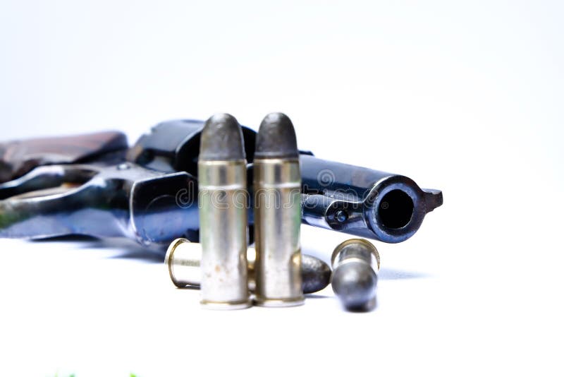 Revolver with Bullets on the Table Stock Photo - Image of holding ...
