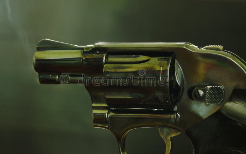 Revolver Gun Muzzle with Smoke Floating in the Air after Shoot on Black ...
