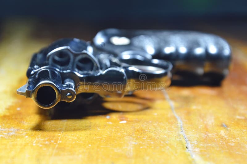 Revolver Gun on Wooden Table Stock Image - Image of tool, carry: 78450307