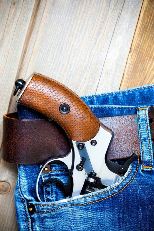 Revolver in the pocket stock image. Image of weapon, army - 67661677