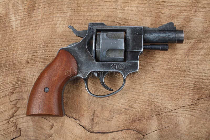 Revolver on the table stock photo. Image of black, caliber - 112435764