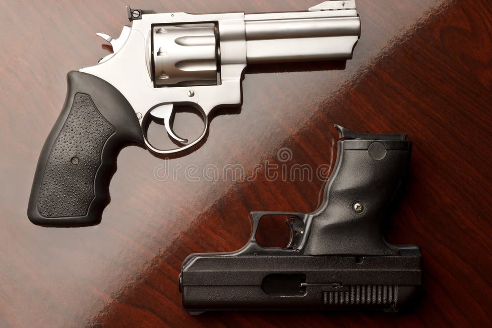 Revolver vs Handgun stock image. Image of body, action - 20995381