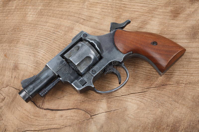 Revolver stock photo. Image of hand, accessories, table - 122456148