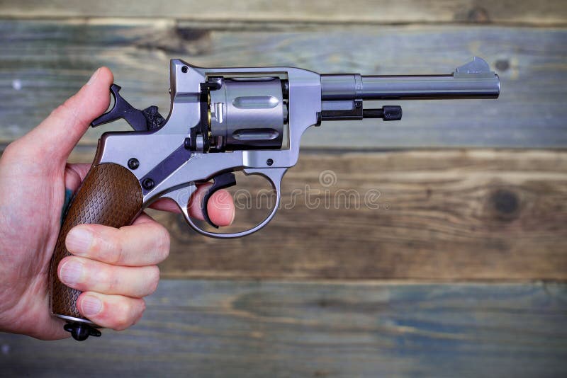 Silberner Revolver Nagant Mit Braunem Griff In Der Tasche Stockbild ...