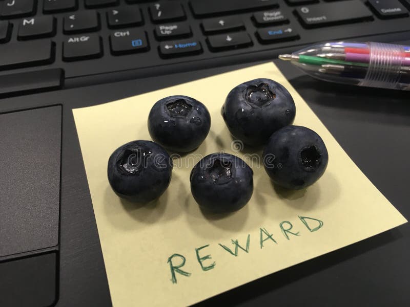 Reward - Handwritten on a Post-it, on a Computer Keyboard Stock Photo ...