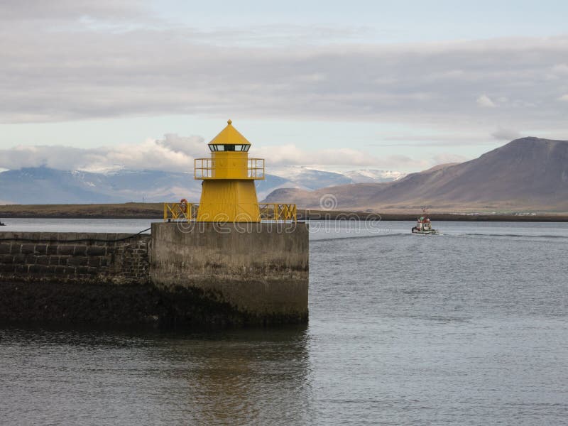 Reykjavik Harbor Yellow Lighthouse Stock Photo - Image of city, ocean ...