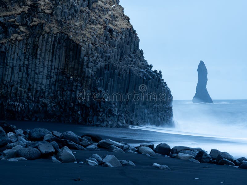 Reynisfjara Beach at Twilight, Featuring the Iconic Reynisdrangar Sea ...
