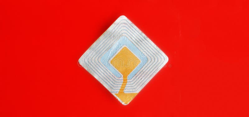 RFID Tag Transponder Label on a Bright Red Background. the Concept of ...