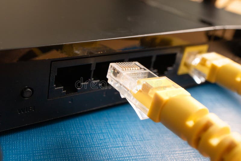 The Rg45 Patch Cord is Inserted into the Black Connector of the Router ...