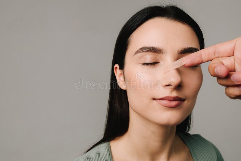 Rhinoplasty. Plastic Surgeon is Taping Nose To Patient during ...