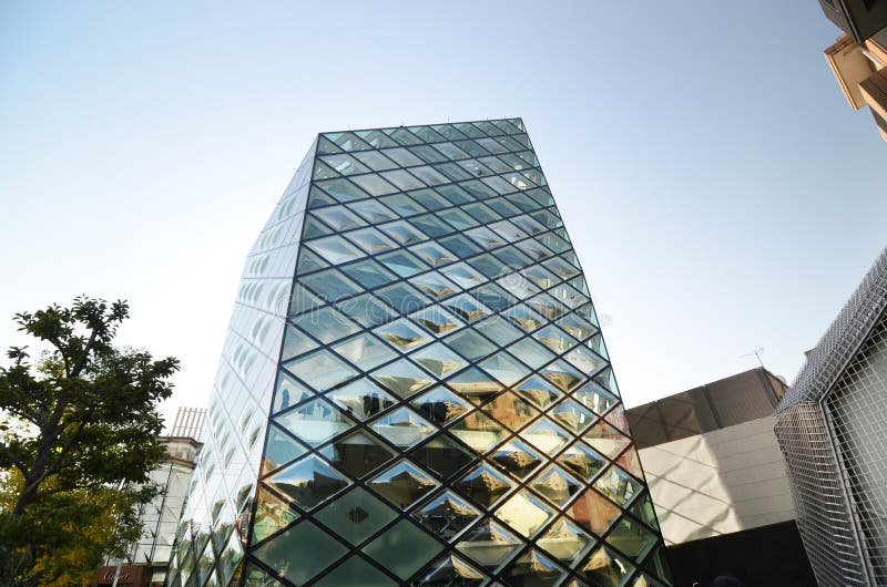 Rhomboid-grid Glass Building in Tokyo Stock Image - Image of emerald ...