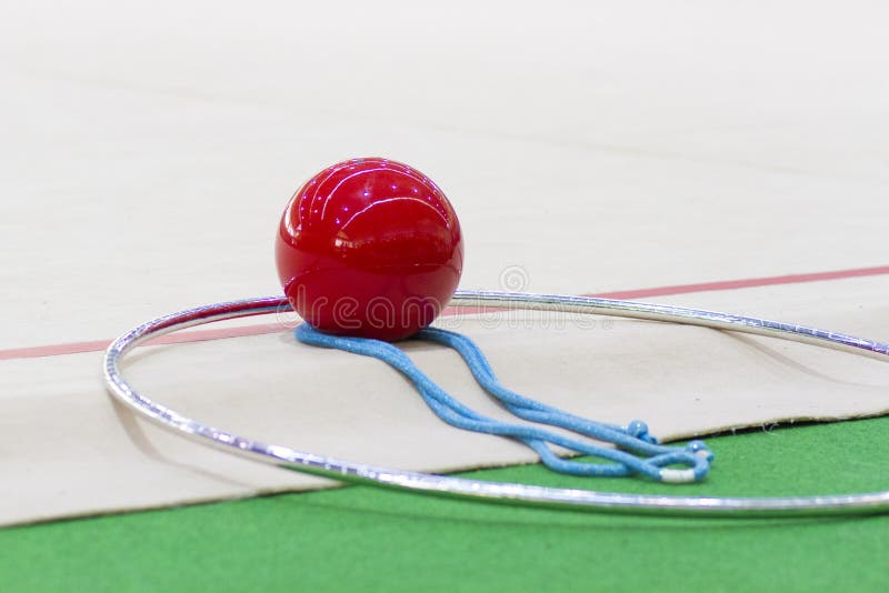Rope, Ball, and Hoop at the Edge of a Gymnastics Carpet Stock Image ...