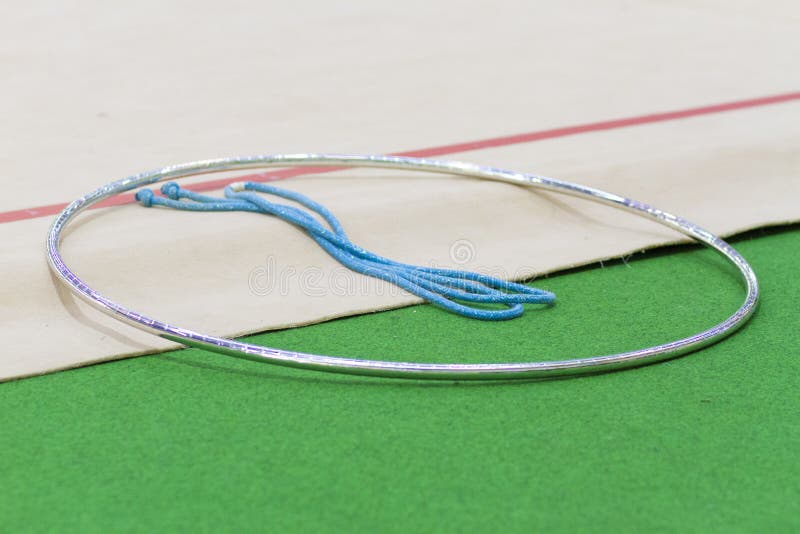 Rope and Hoop at the Edge of a Gymnastics Carpet Stock Photo - Image of ...