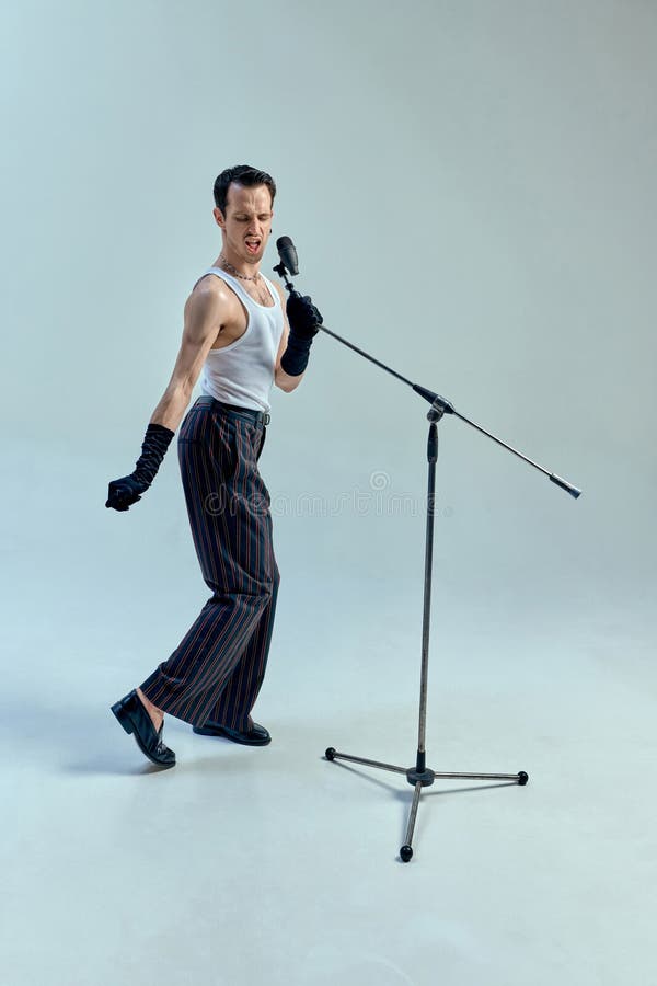 Rhythmic Tension Embodied in Angular Stance, Artist Fully Immersed in ...