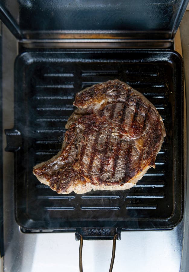 Rib Eye Beef Cooking on Cast Iron Griddle Stock Image - Image of grill ...