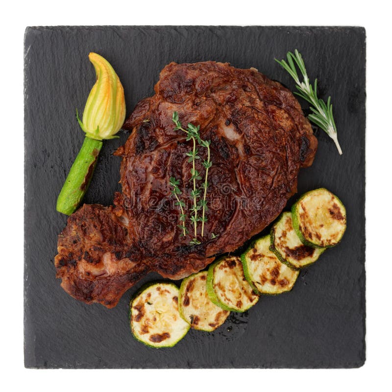 Rib Eye Steak on Black Slate Plate Stock Image - Image of topping ...