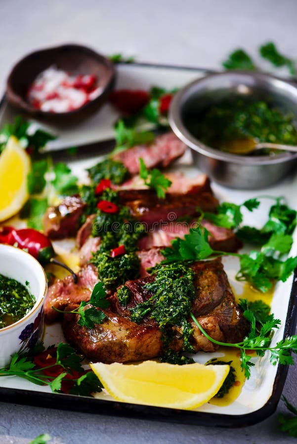 Rib Eye Steak with Chimmichurri Sauce. Stock Photo - Image of dinner ...