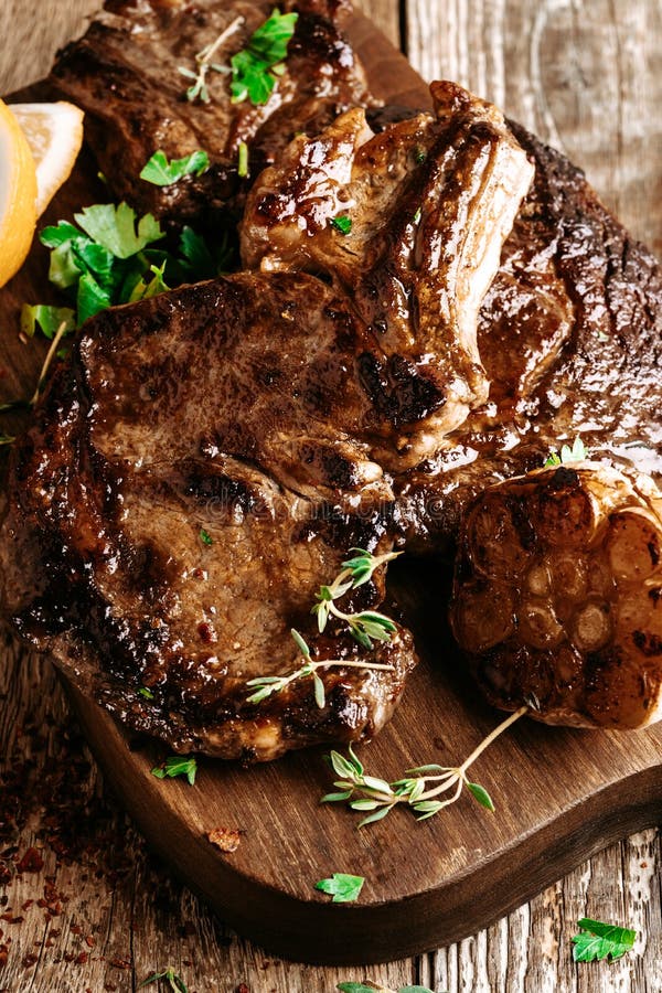 Rib Eye Steak with Herbs and Garlic Stock Photo - Image of gourmet ...
