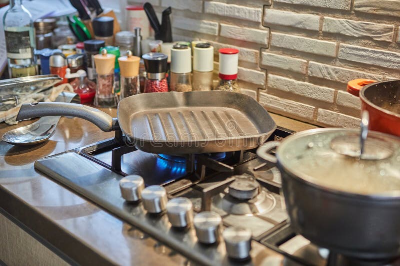Ribbed Pan is Heated for Cooking Over Fire on Gas Stove Stock Photo ...