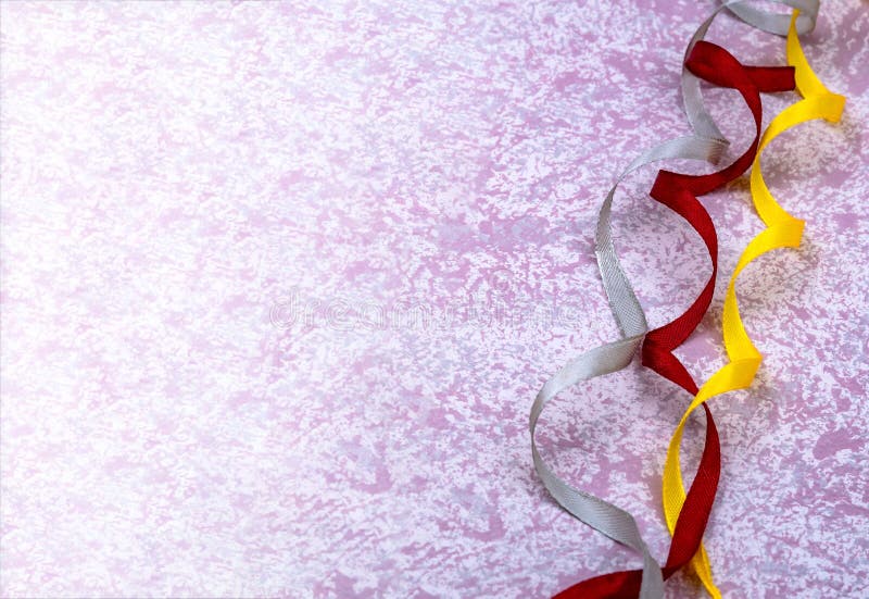 Ribbons on a Pink Background. Yellow and Red Ribbons on a Light Pink ...
