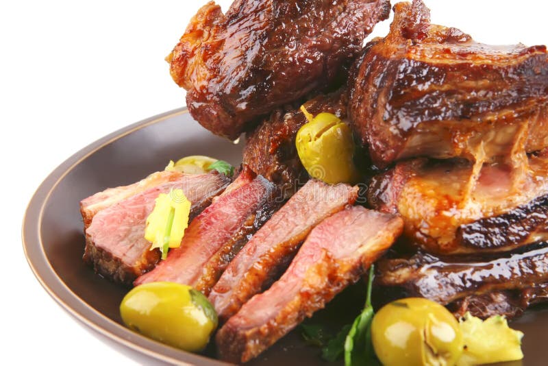Ribs on Old Style Dish Over White Stock Image - Image of appetizers ...