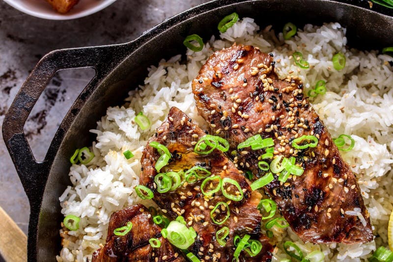 Deep-Fried Orange Chicken Served on a Bed of Steamed White Rice ...