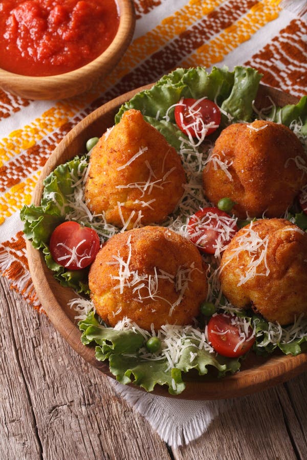 Rice Balls Stuffed with Meat and Tomato Sauce Closeup. Vertical Stock ...