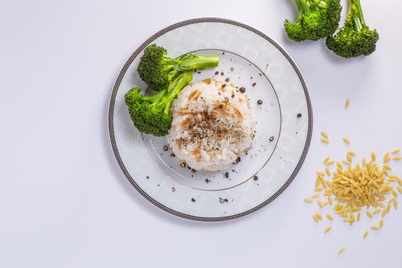 Rice with Barley Noodles and Fresh Broccoli on the Plate Stock Image ...