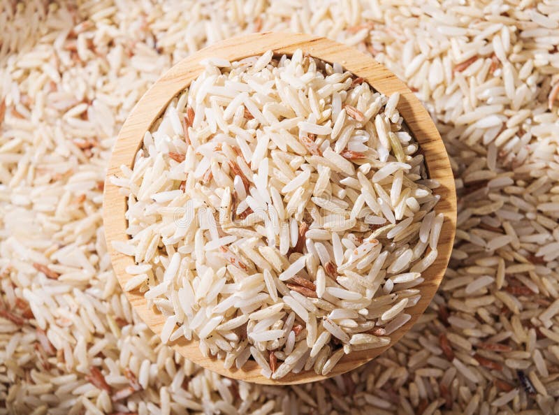 Rice berry in wooden bowl stock image. Image of cuisine - 76762529