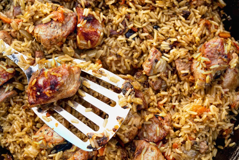 Rice with Blueberry, Beef and Carrots in a Cauldron on Fire with a ...