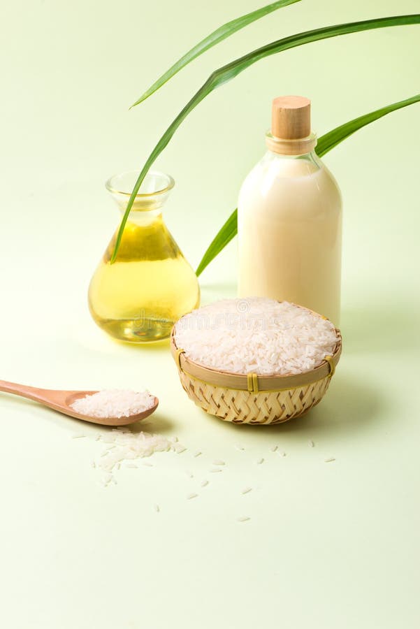 Rice Bran Oil in a Glass and Jar with Uncooked Jasmine Rice Stock Image ...
