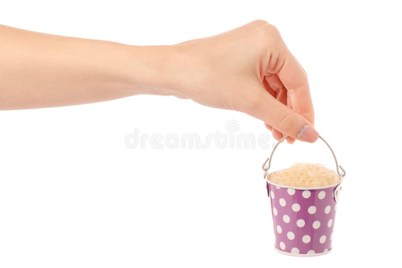 Rice in a bucket in hand stock image. Image of colorful - 107094025