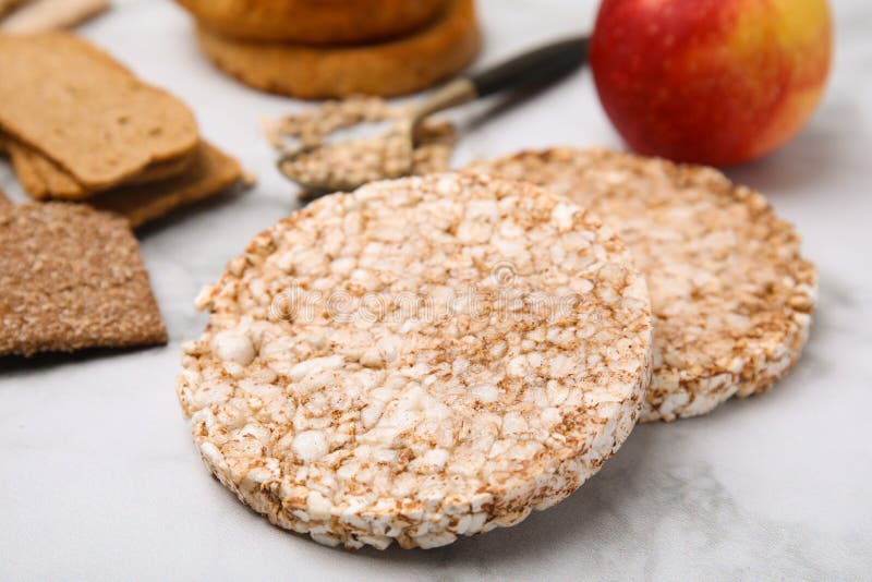 Rice Cakes and Rusks on White Marble Table, Closeup Stock Photo - Image ...