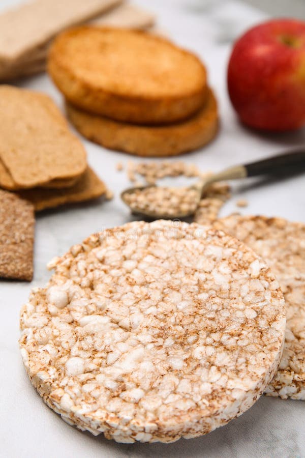 Rice Cakes and Rusks on White Marble Table, Closeup Stock Photo - Image ...