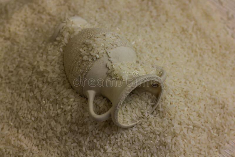 Rice in Ceramic Jar on a Scattered Rice Stock Image - Image of full ...