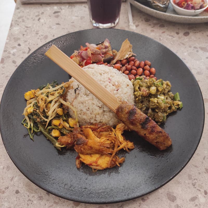 Rice with Chicken Satai, Vegetables, Peanuts and Sambal Matah Stock ...