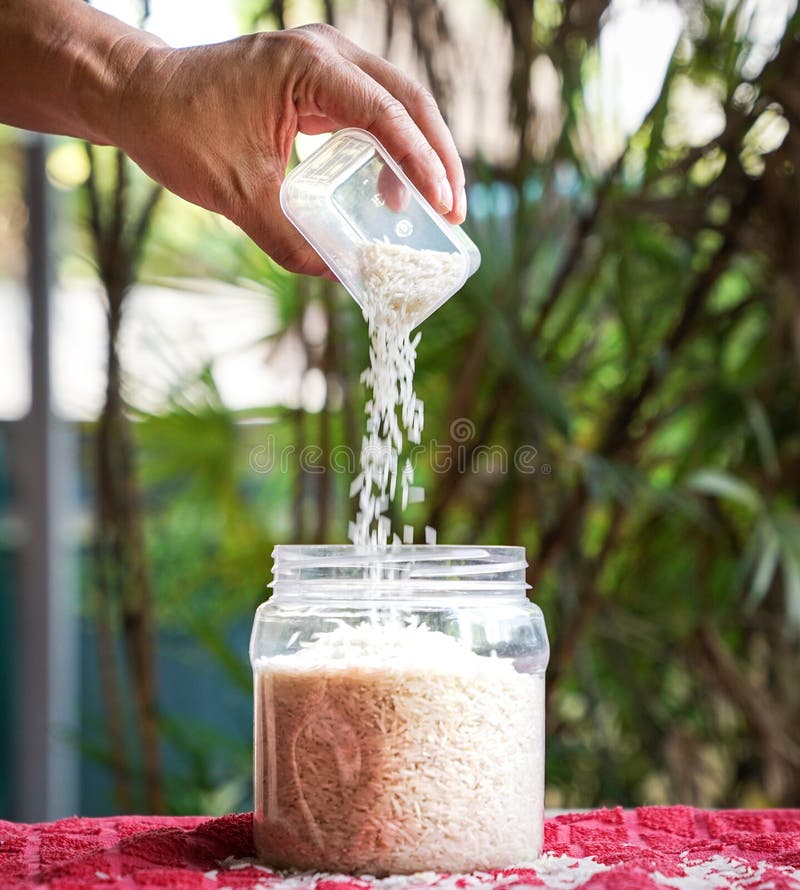 Rice in a container stock image. Image of food, pouring - 136411361