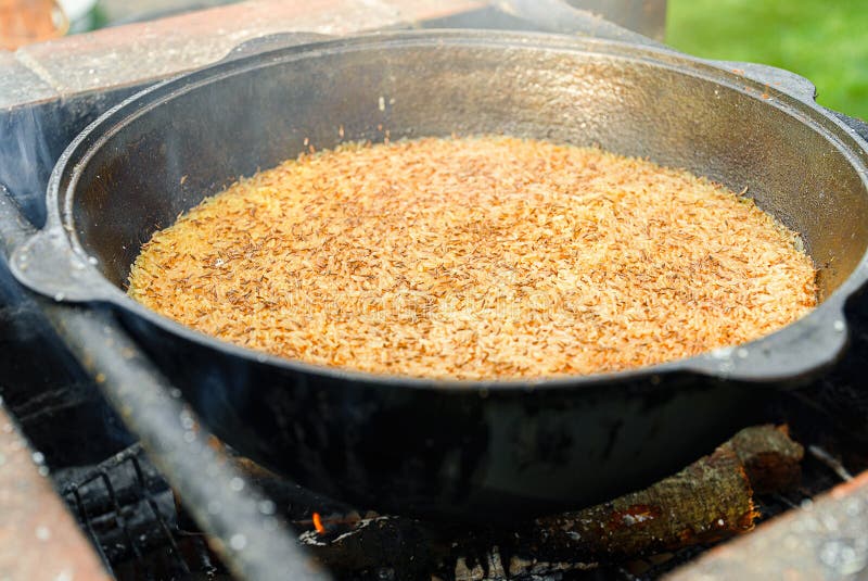Rice is Cooked in Cauldron on Fire. Stock Image - Image of preparation ...