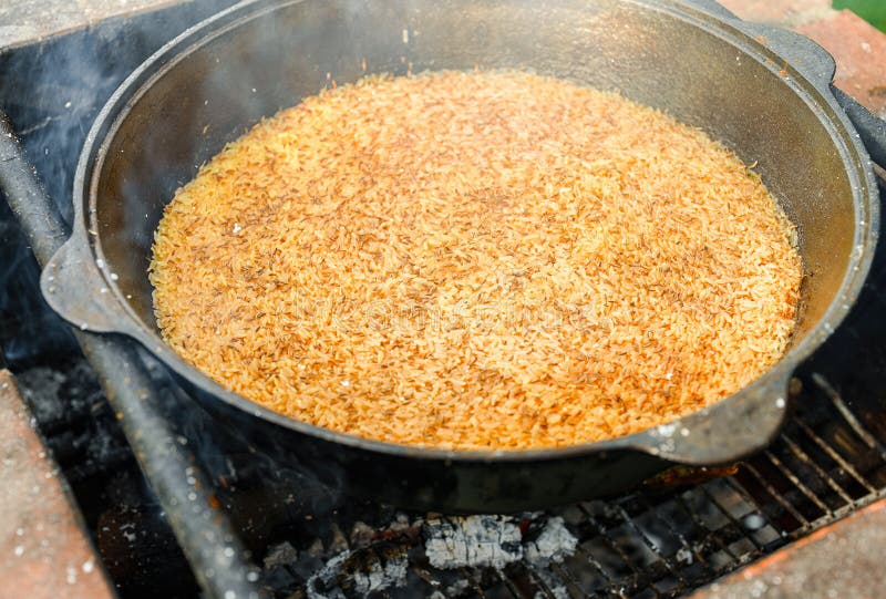 Rice is Cooked in Cauldron on Fire. Stock Image - Image of zira, recipe ...