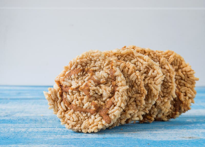 Rice Crackers on Blue Wooden Floor. Stock Photo - Image of cereal ...