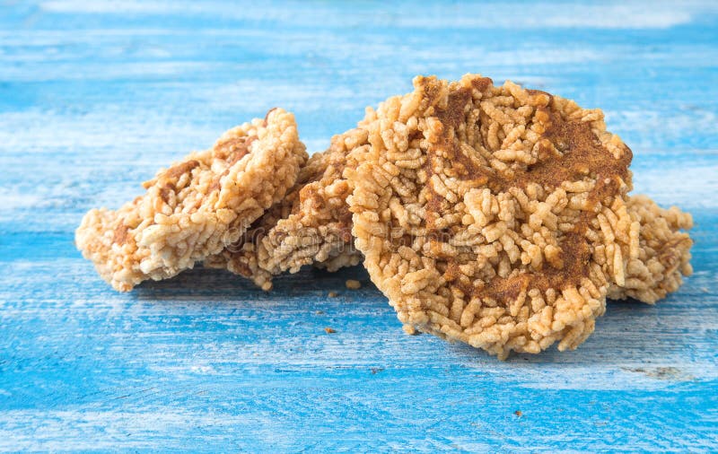 Rice Crackers on Blue Wooden Floor. Stock Image - Image of snack, stack ...