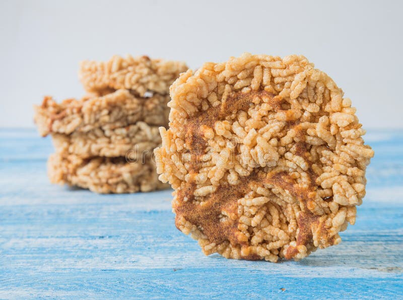 Rice Crackers on Blue Wooden Floor. Stock Photo - Image of cracker ...