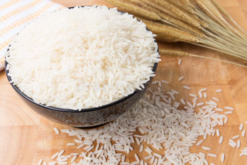 Rice in the cup stock photo. Image of wooden, crop, scoop - 35468082