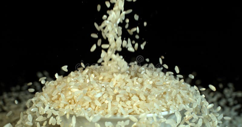 Rice Falling Against Black Background Stock Image - Image of indoors ...